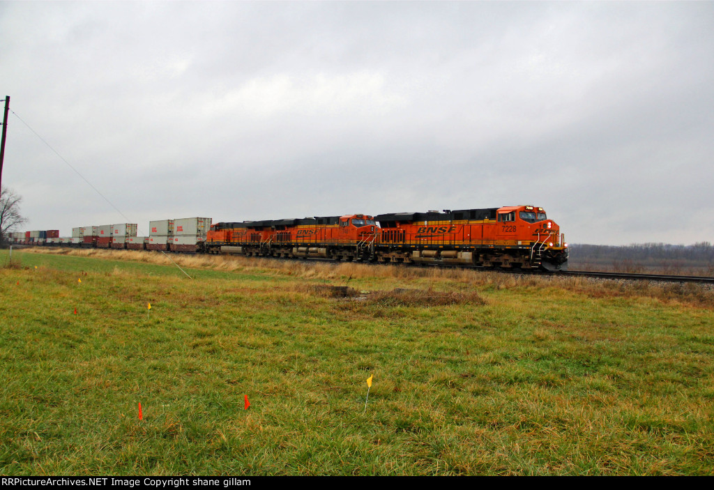 BNSF 7228 Heads Eb with a stack train.